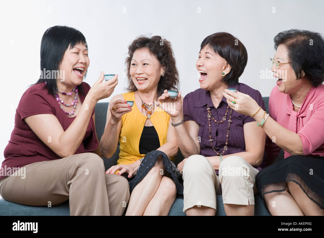 Mature ladies laughing drinking hi-res stock photography and images - Alamy