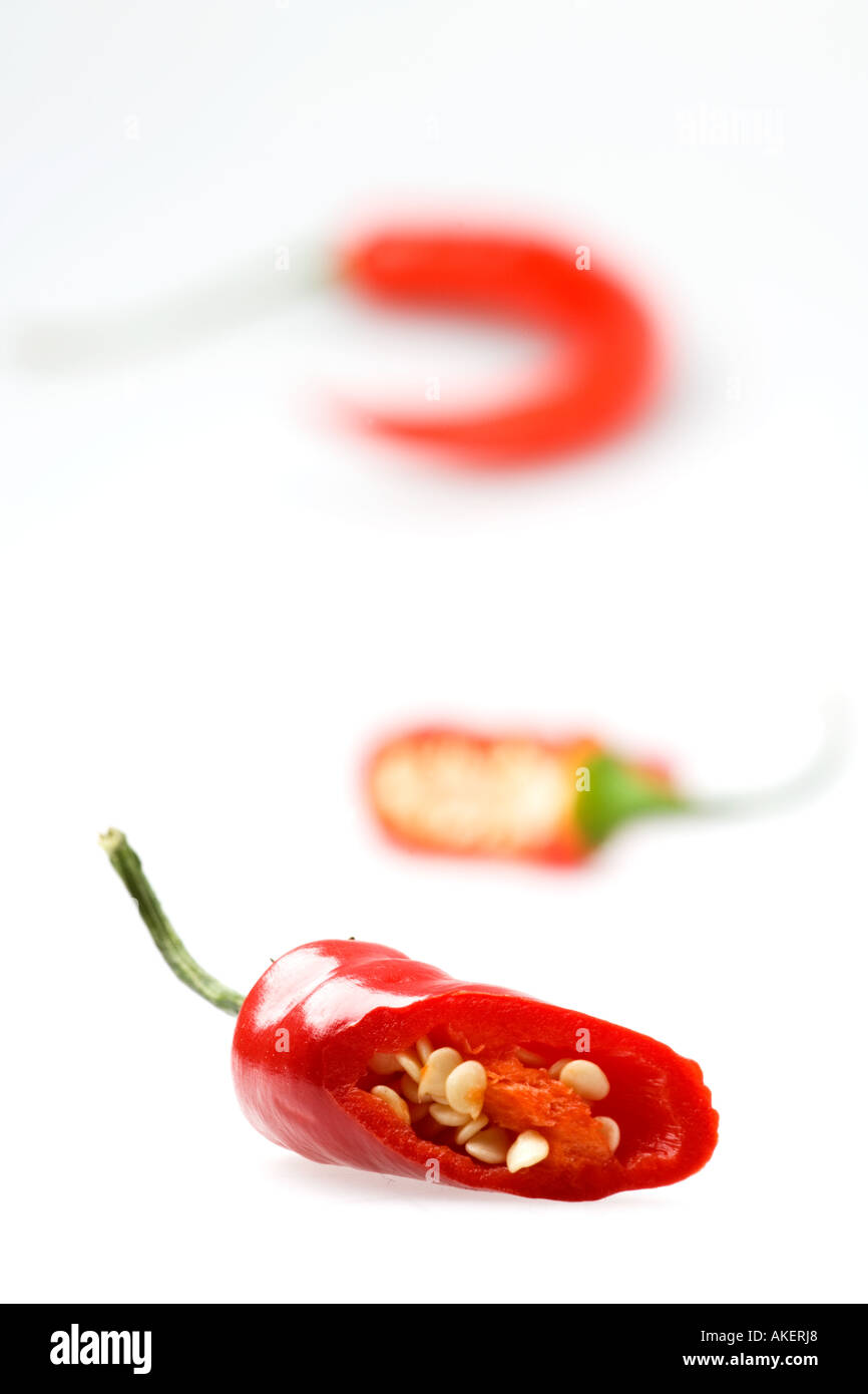 Three Hot red chilli sliced to show seeds Stock Photo - Alamy
