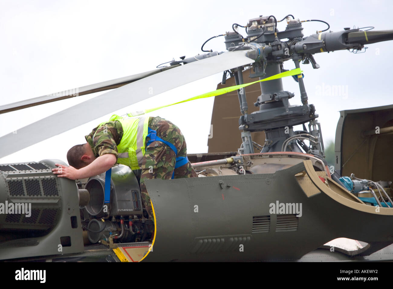 Helicopter maintenance engineer working on engine rotor blades Stock ...