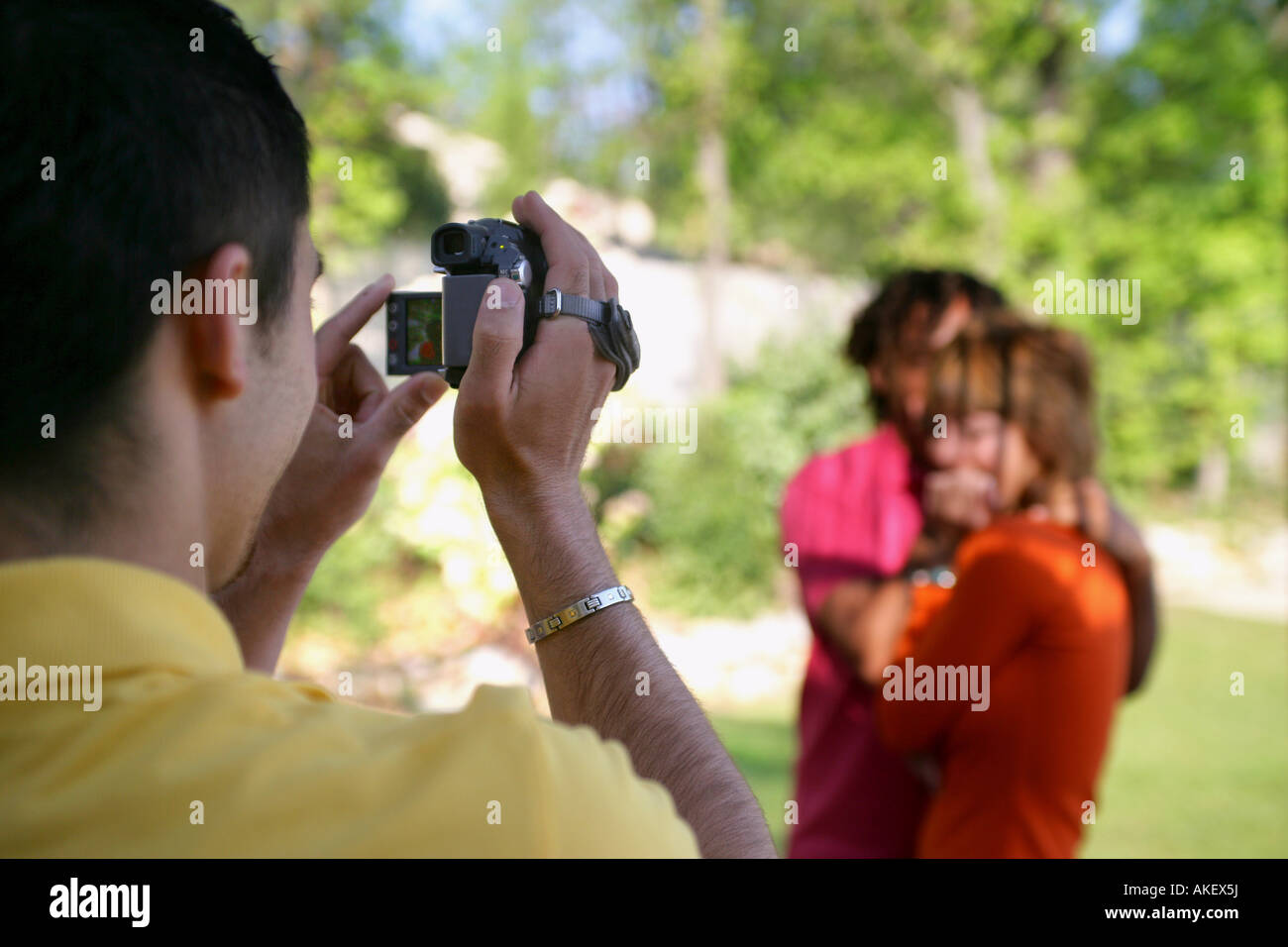 young man with video camera Stock Photo - Alamy