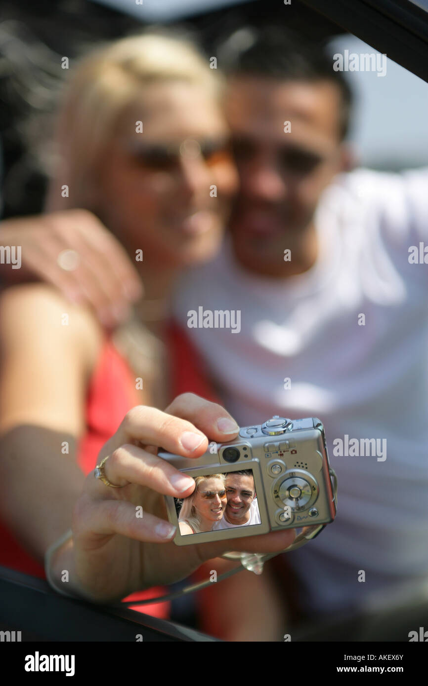 young couple with camera Stock Photo - Alamy