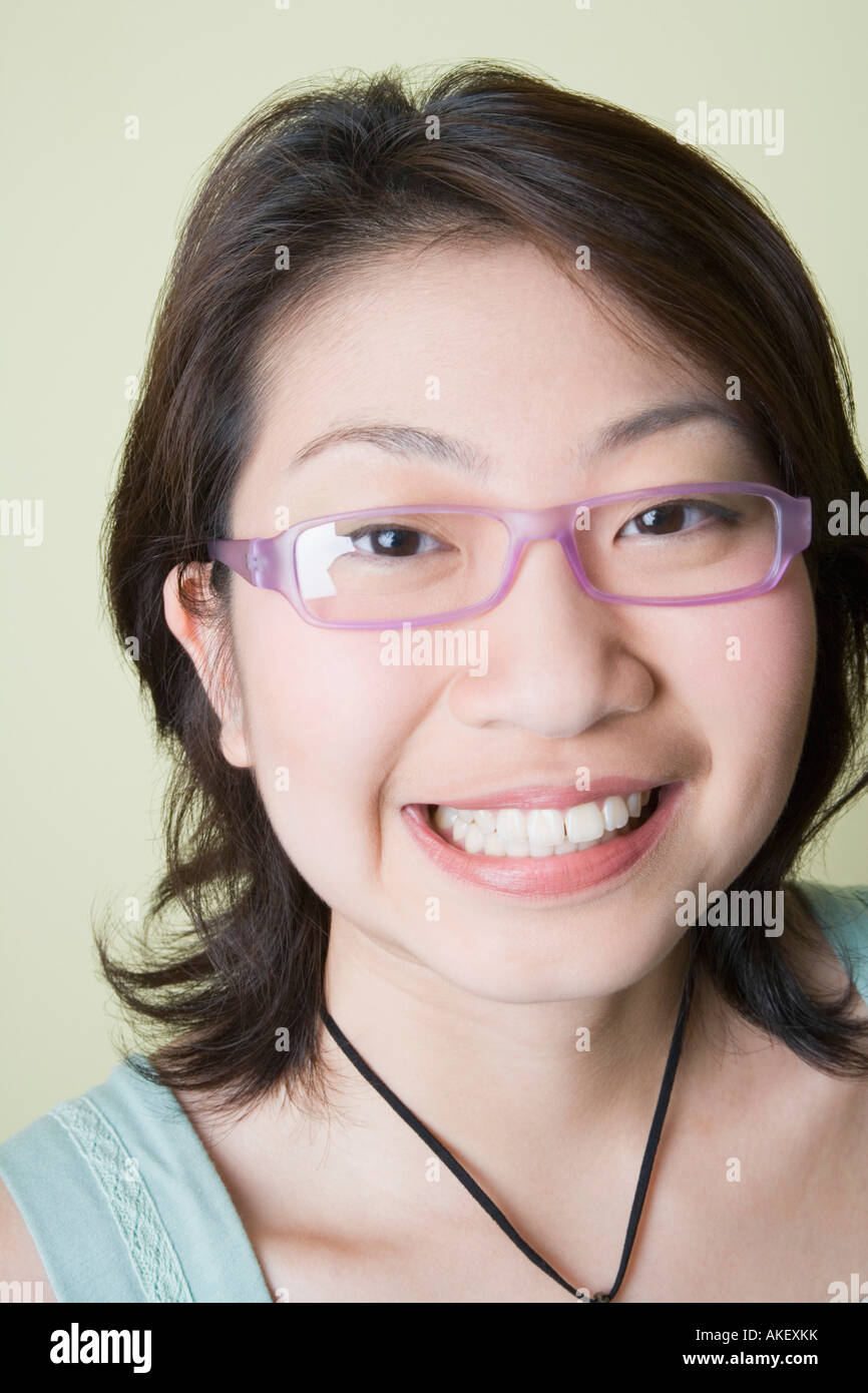 Portrait of a young woman clenching her teeth Stock Photo - Alamy