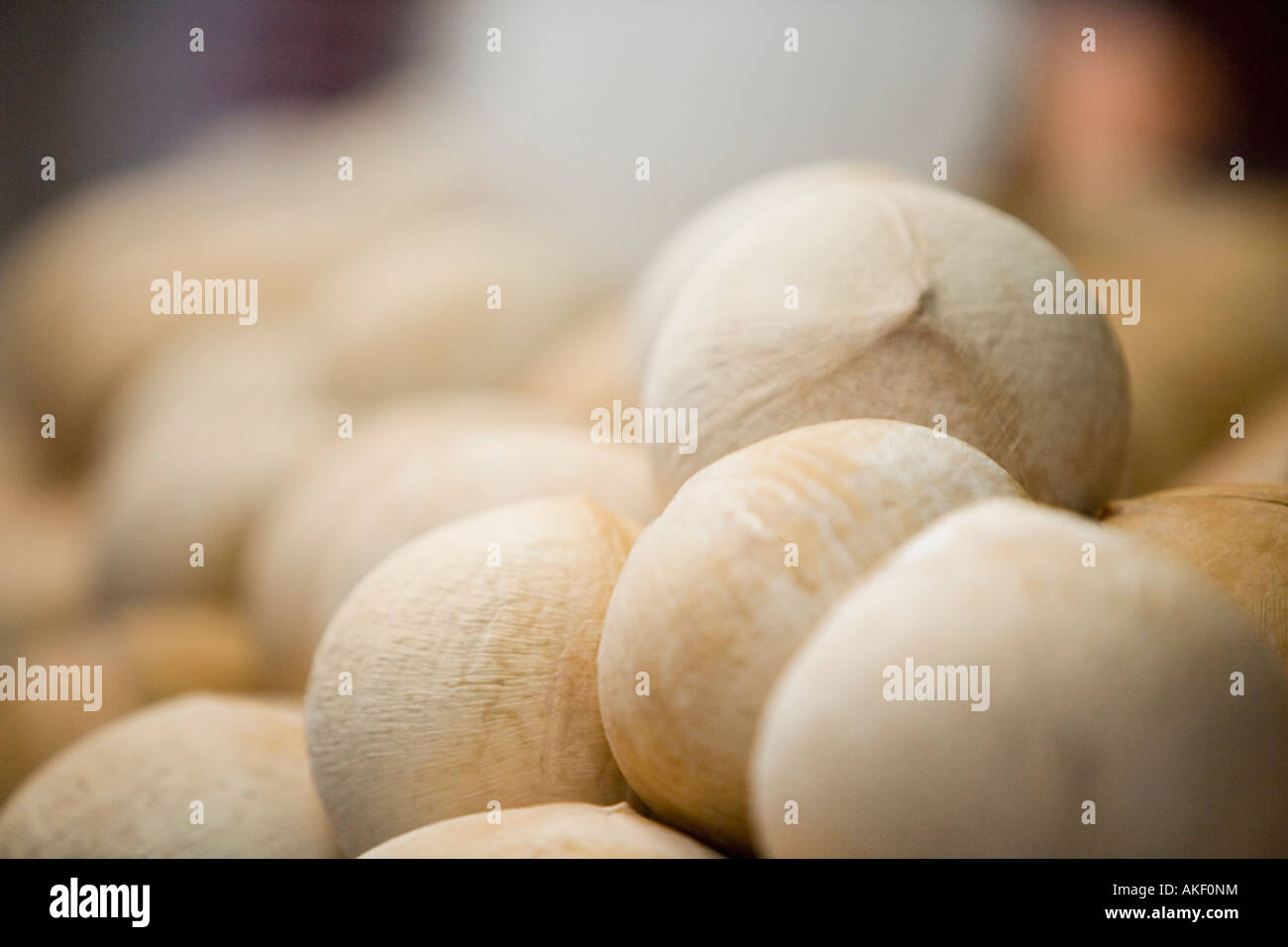 Close-up of a heap of coconuts at a market stall Stock Photo - Alamy