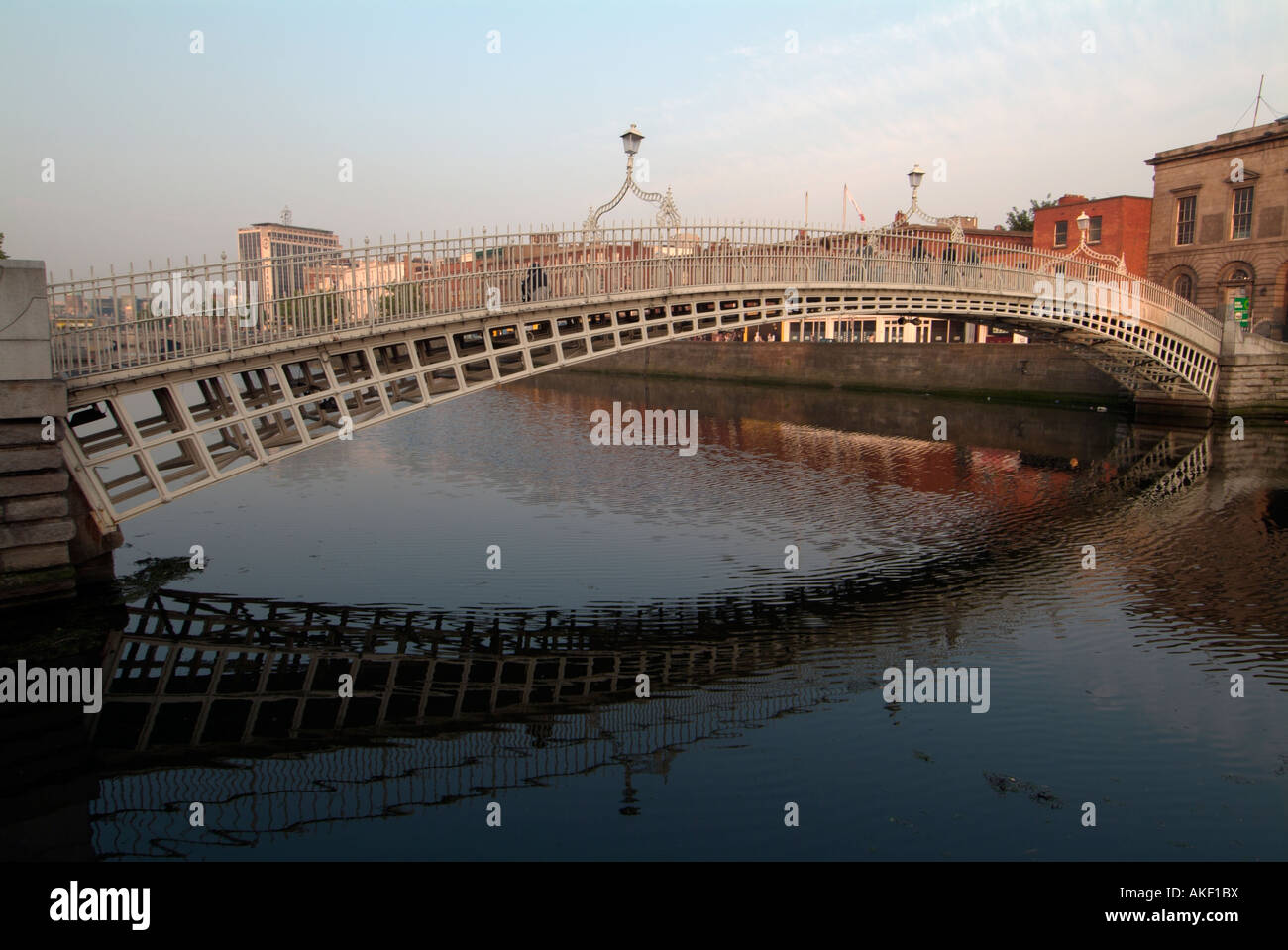 The ha'penny hapenny or halfpenny pedestrian bridge and its reflection ...
