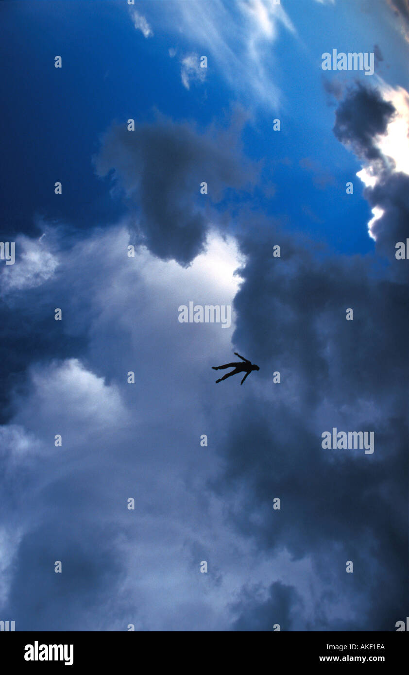 Sky diver falling through the clouds Stock Photo - Alamy