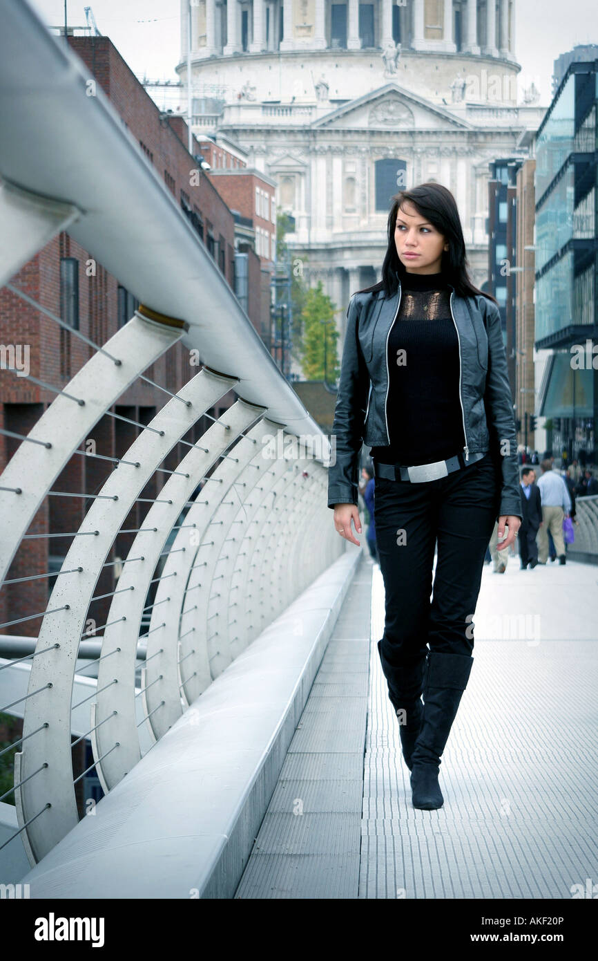 Girl walking over millenium bridge London Stock Photo - Alamy
