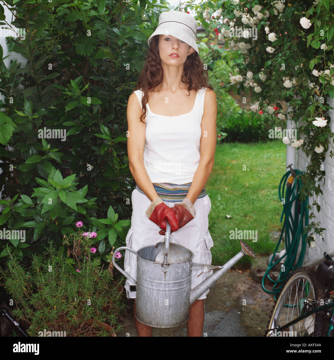 Woman tending the garden Stock Photo - Alamy