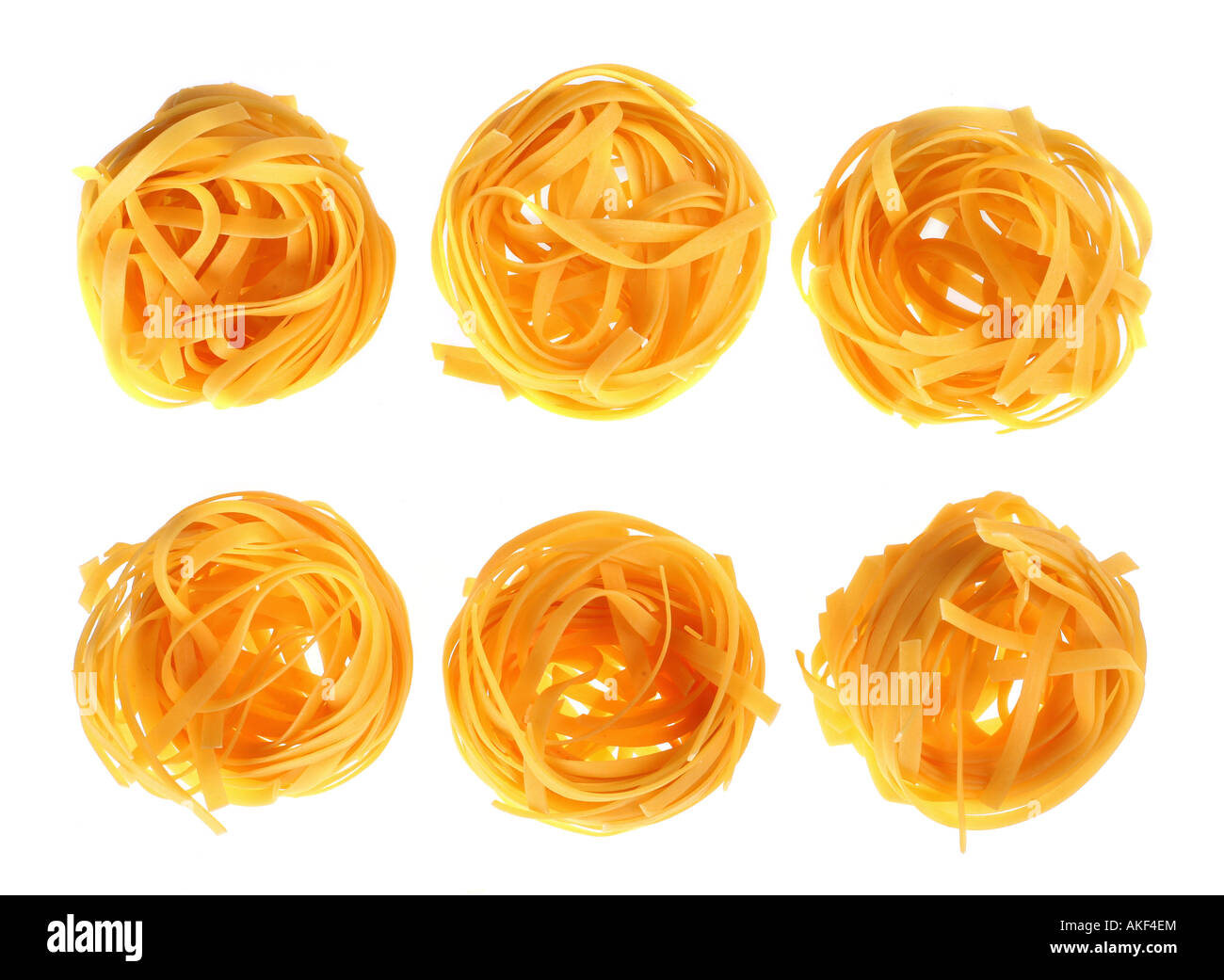 Raw round pasta isolated on white background Stock Photo - Alamy