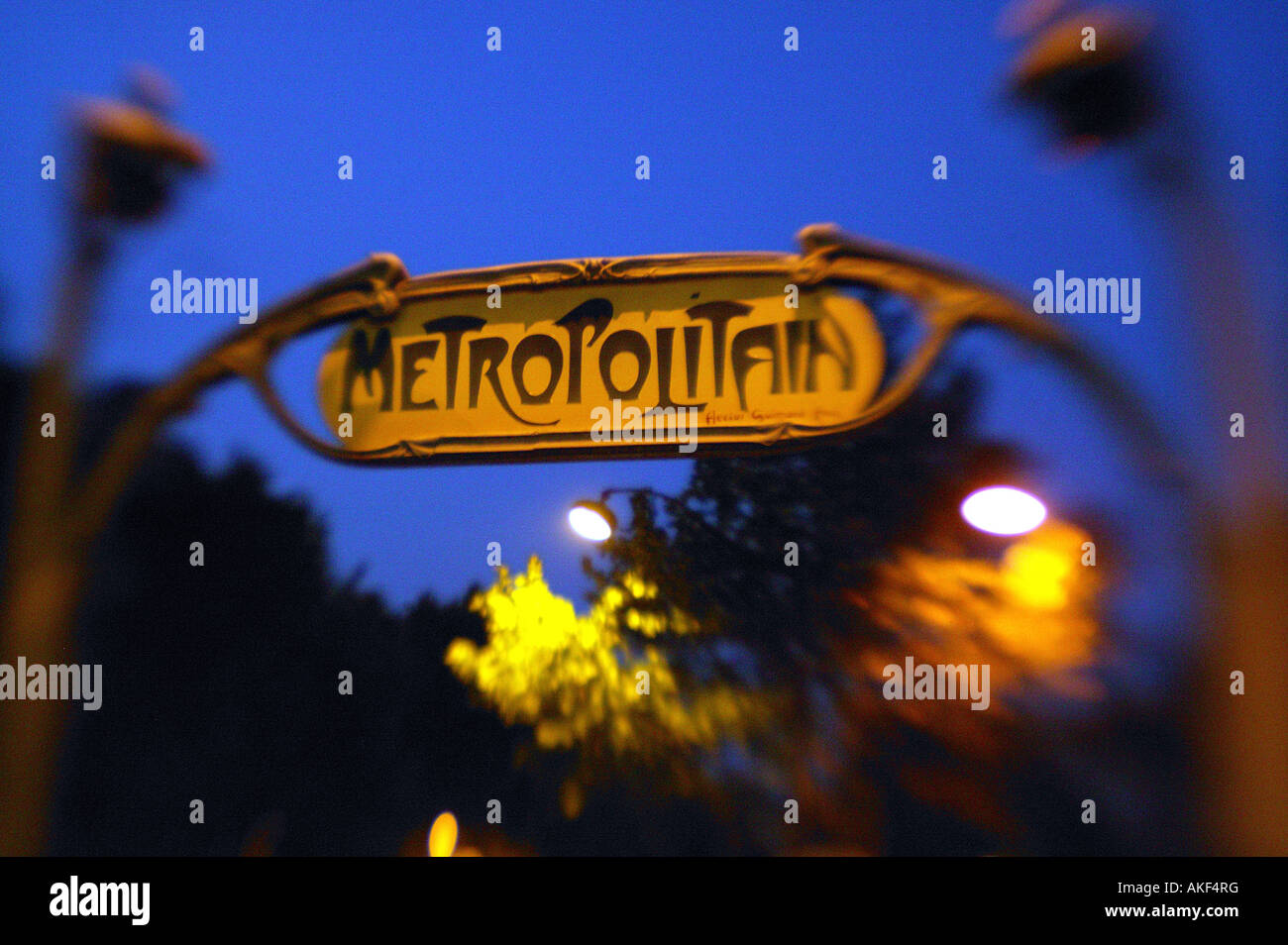 Paris Metro sign at night Stock Photo - Alamy
