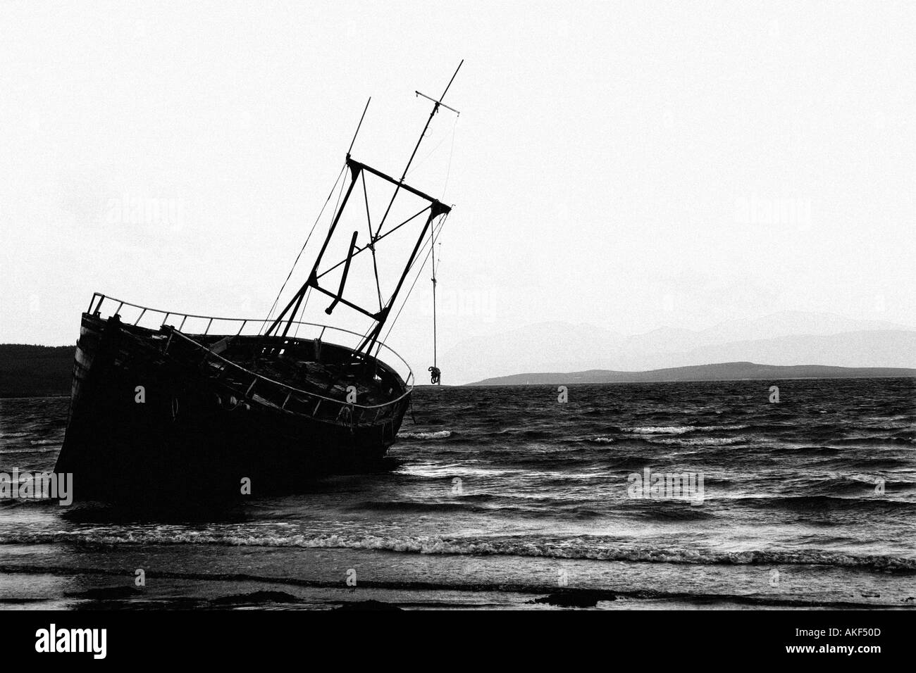 Wrecked boat on beach Stock Photo - Alamy
