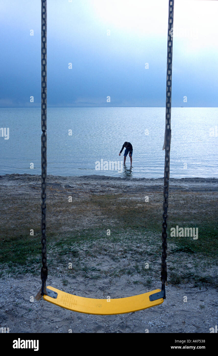 Swing set at the beach on Gulf Of Mexico Stock Photo - Alamy