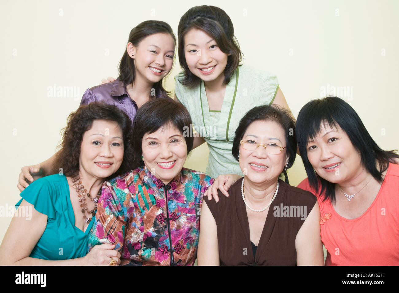 Portrait of a group of women posing and smiling Stock Photo - Alamy