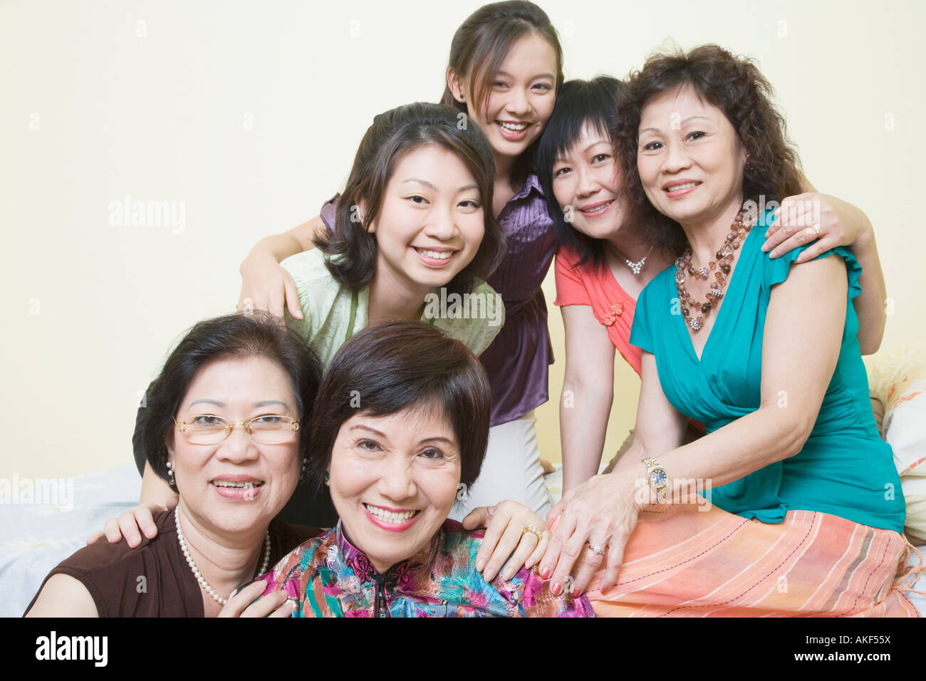 Portrait of a group of women posing and smiling Stock Photo - Alamy