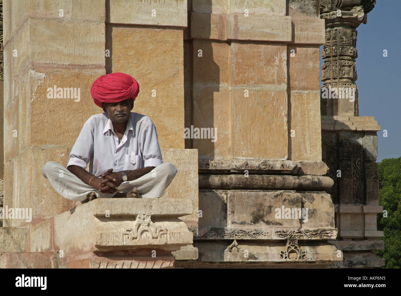 Man sitting outside a temple in Rajasthan India Stock Photo - Alamy