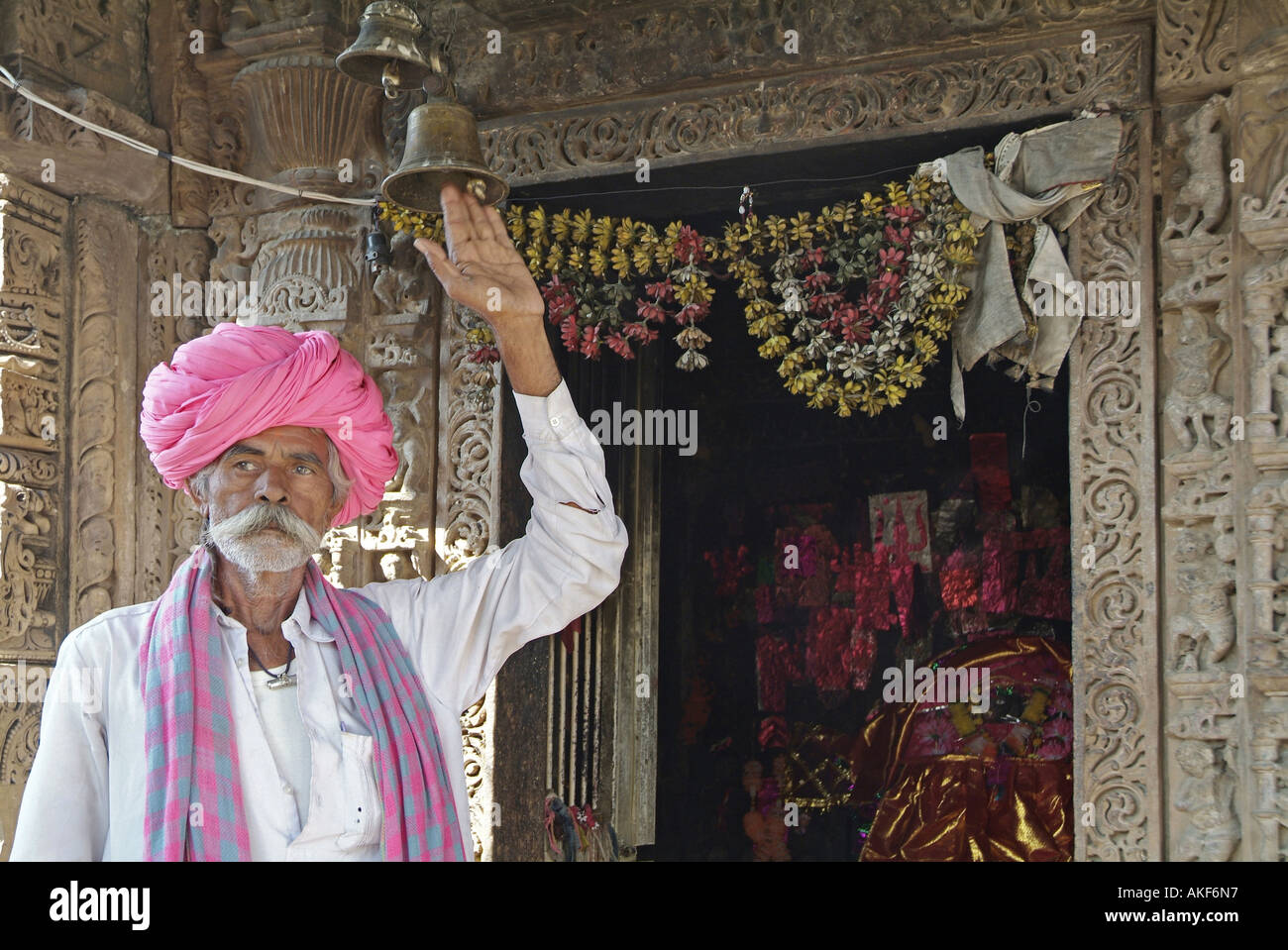 Man ringing temple bell hi-res stock photography and images - Alamy