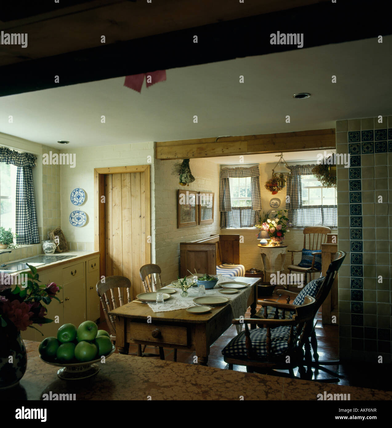 Pine table and chairs in cottage kitchen Stock Photo - Alamy