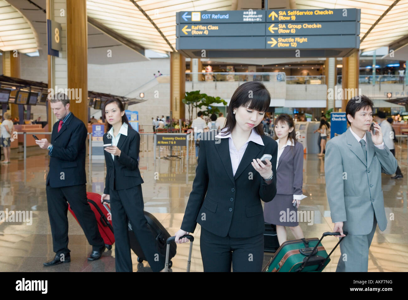 Business executives leaving an airport Stock Photo - Alamy