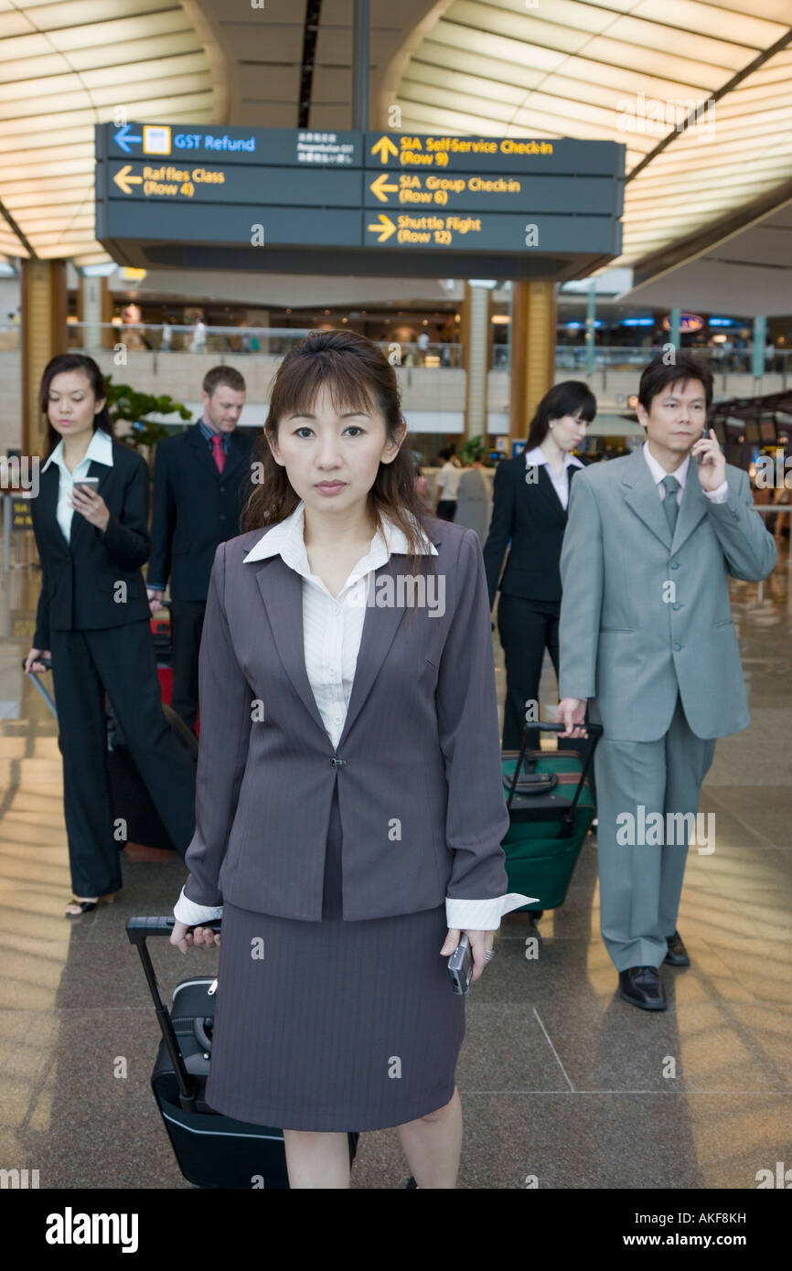 Business executives leaving an airport Stock Photo - Alamy