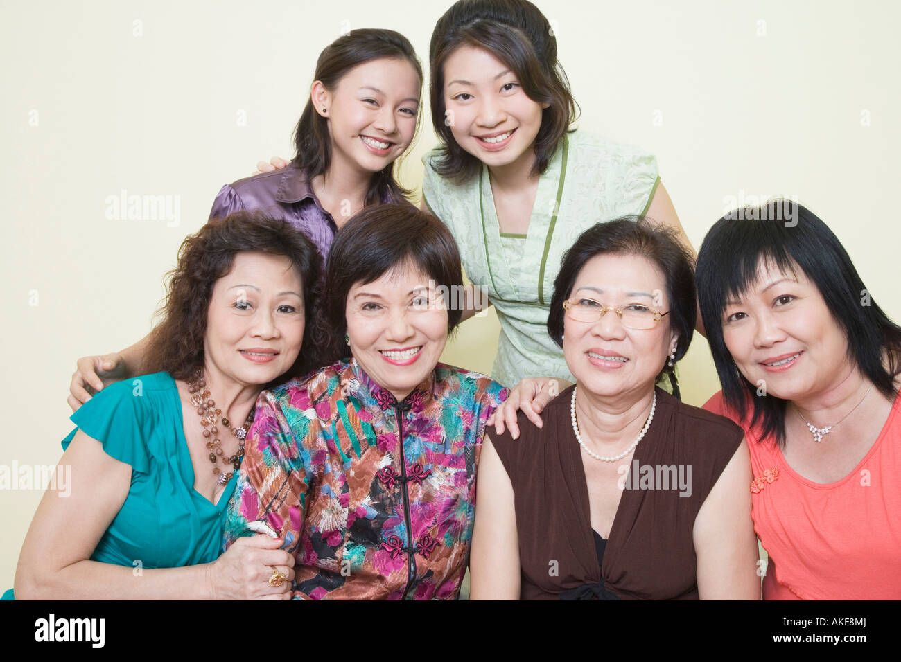 Portrait of a group of women posing and smiling Stock Photo - Alamy