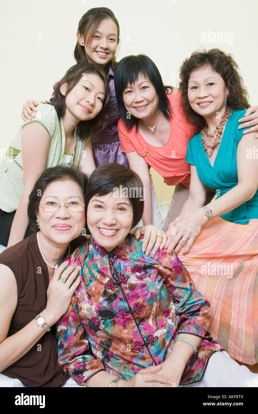 Portrait of a group of women posing and smiling Stock Photo - Alamy