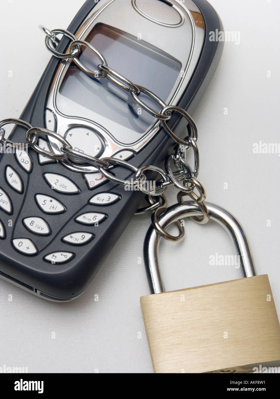 A mobile phone locked up with a padlock and chain Stock Photo - Alamy