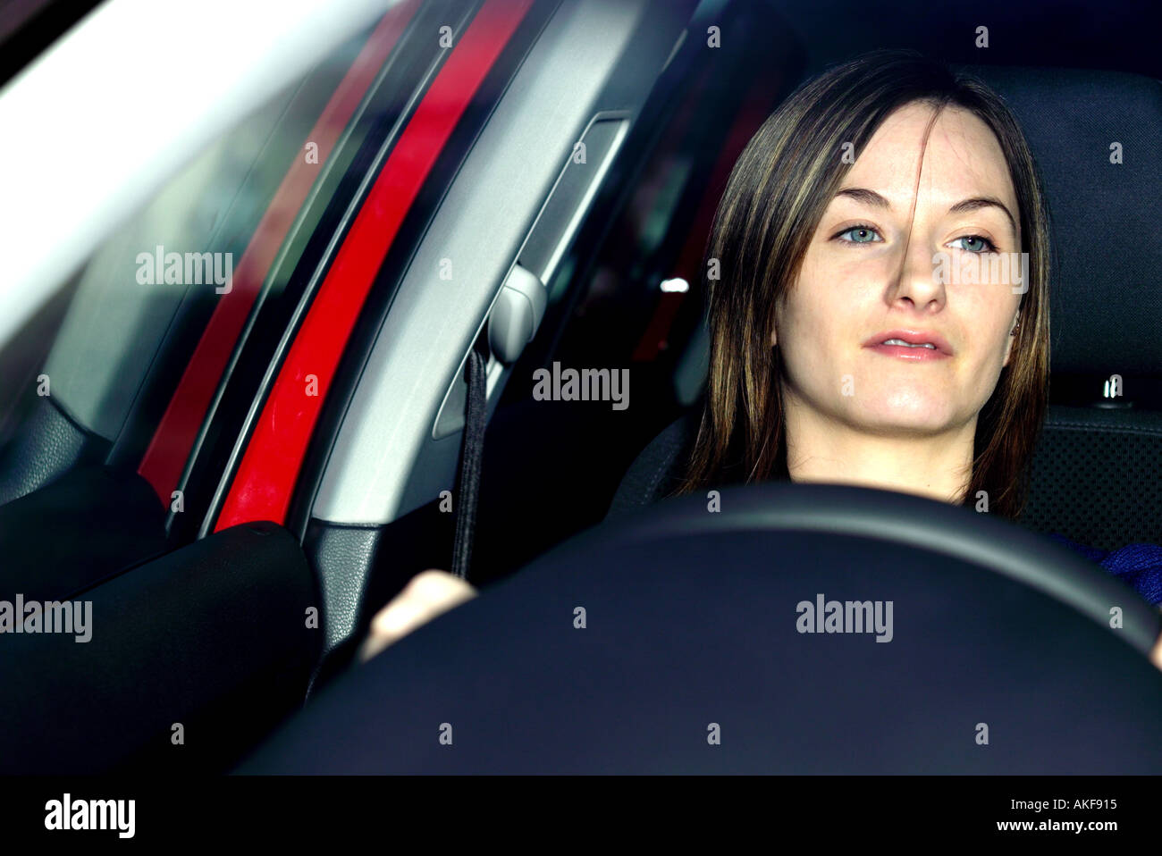 young woman driver through the windscreen vw golf Stock Photo - Alamy