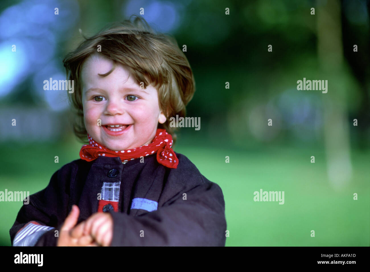 young girl smiling away from camera Stock Photo - Alamy