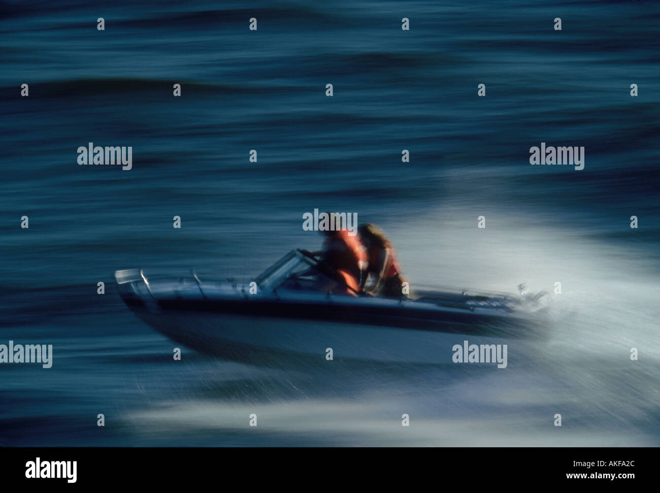 couple on board of speedboat Stock Photo - Alamy