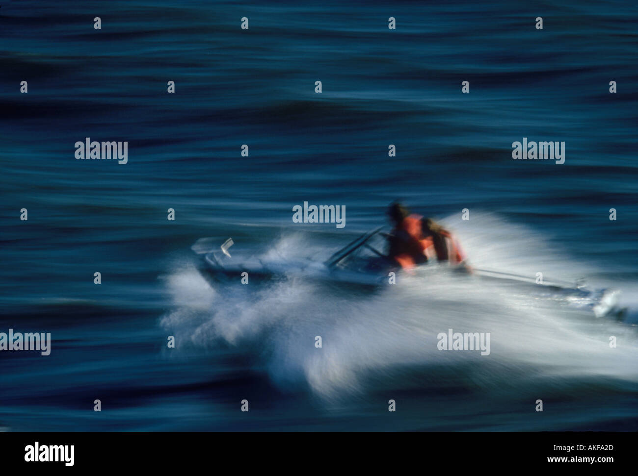 couple on board of speedboat Stock Photo - Alamy