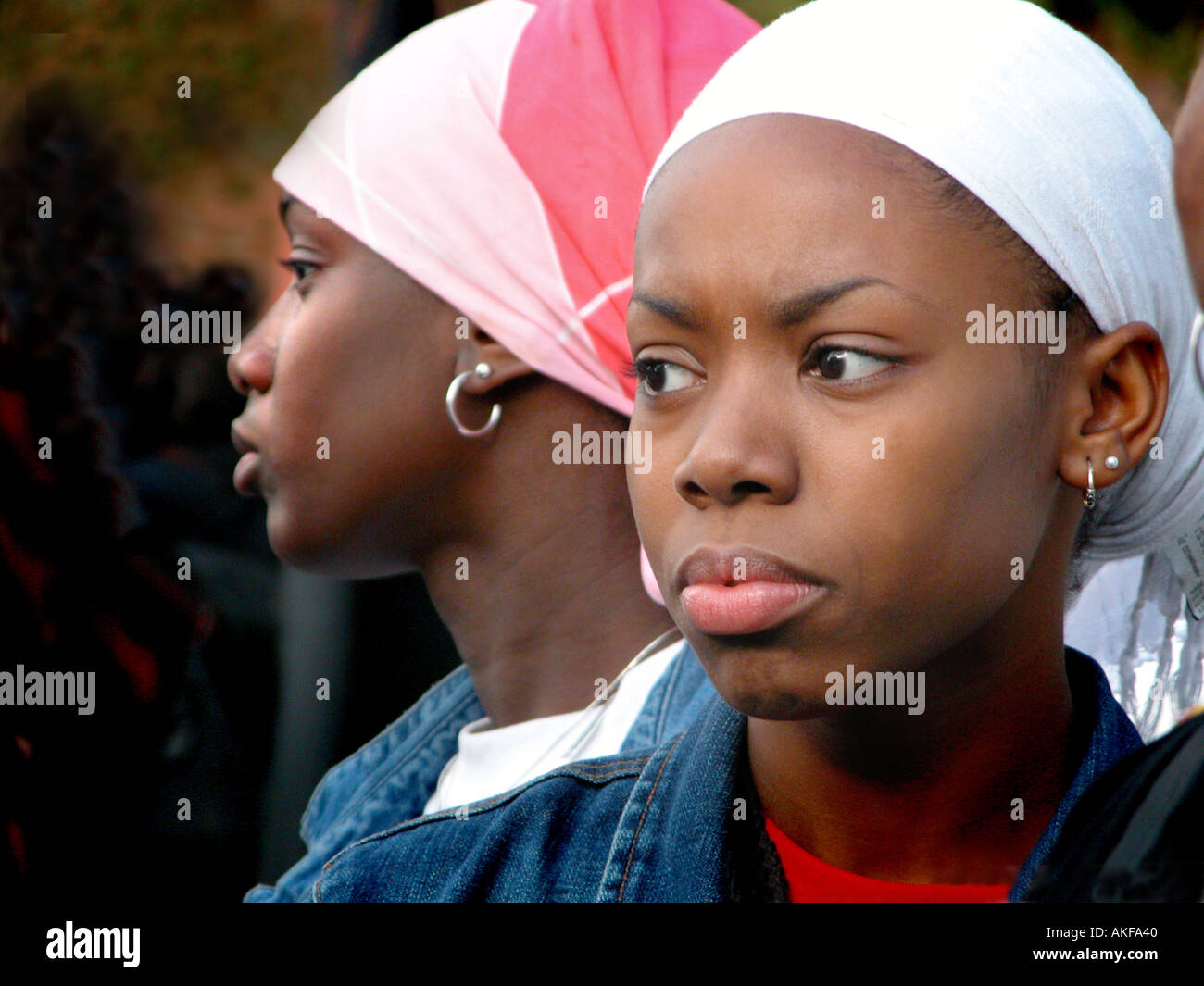 2 young Black Afro ethnic women with Islamic type head garb in with ...