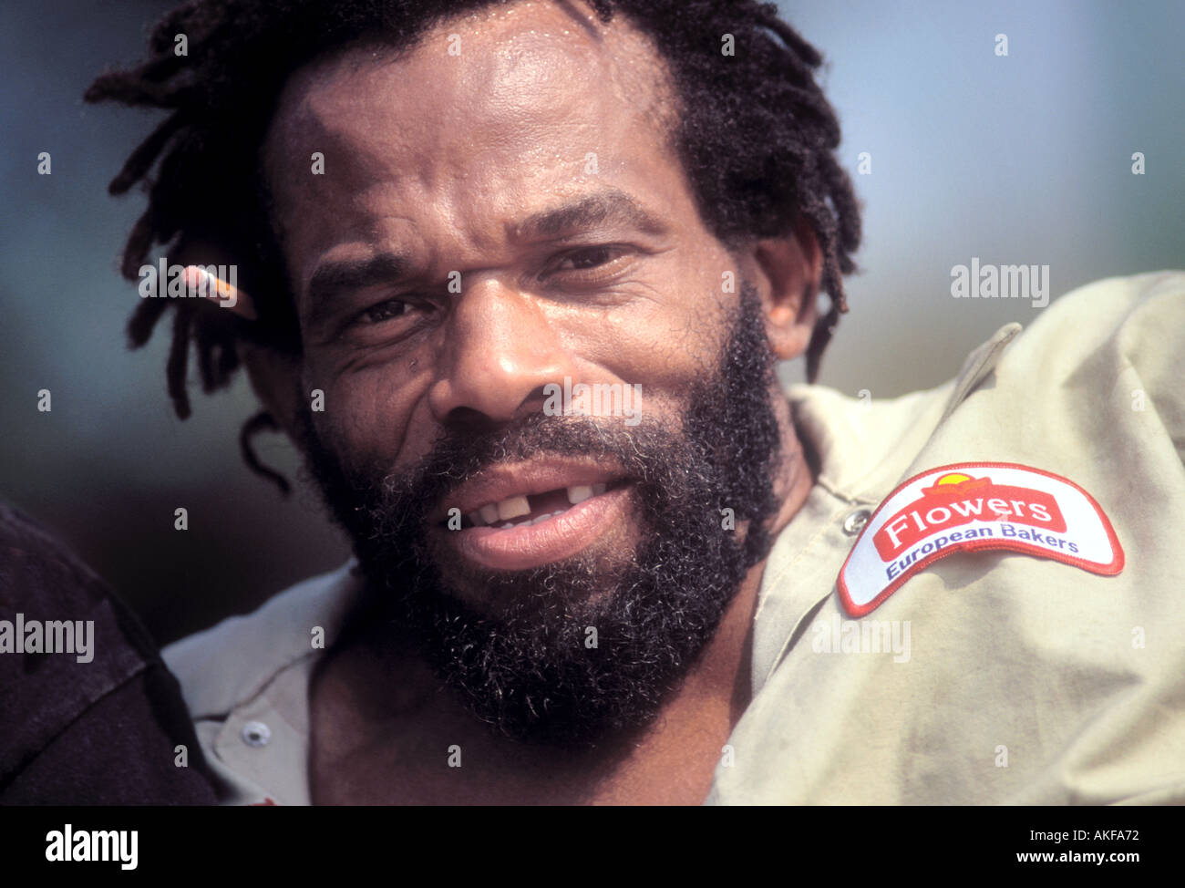 Black Man Smiling With No Teeth