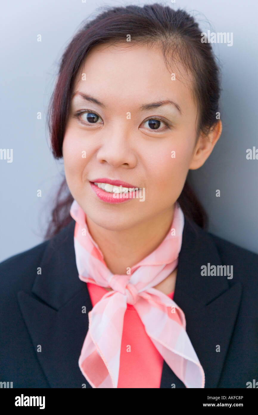 Portrait of a female cabin crew smiling Stock Photo - Alamy