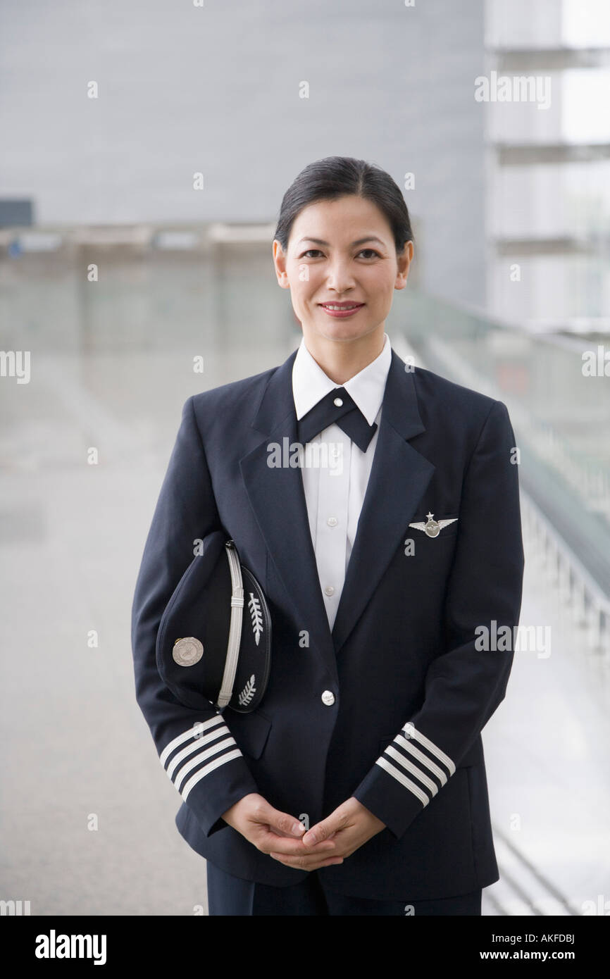 Portrait of a female pilot standing Stock Photo - Alamy