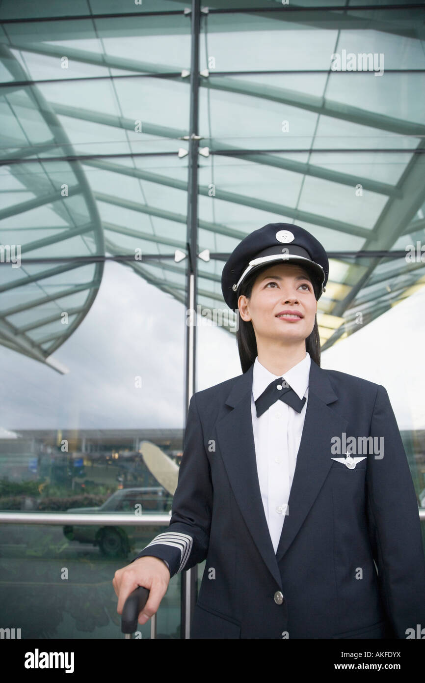 Close-up of a female pilot standing at an airport Stock Photo - Alamy