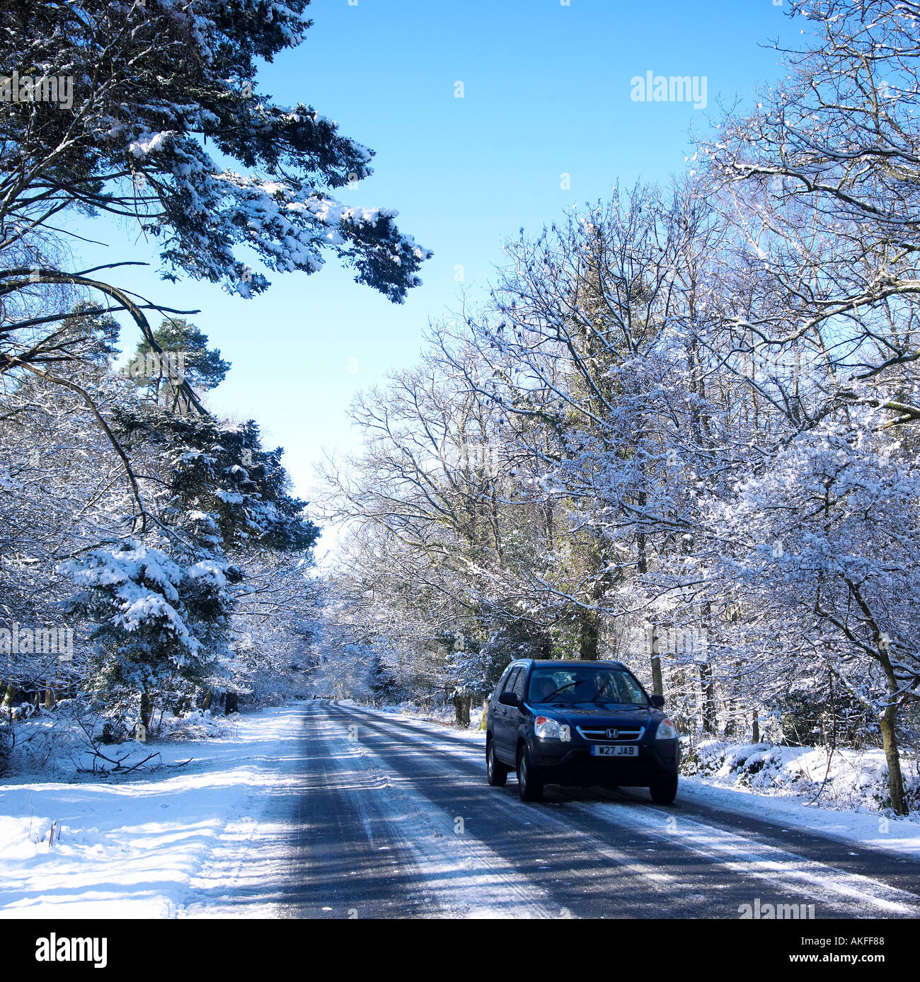 A snowy road scene Stock Photo - Alamy