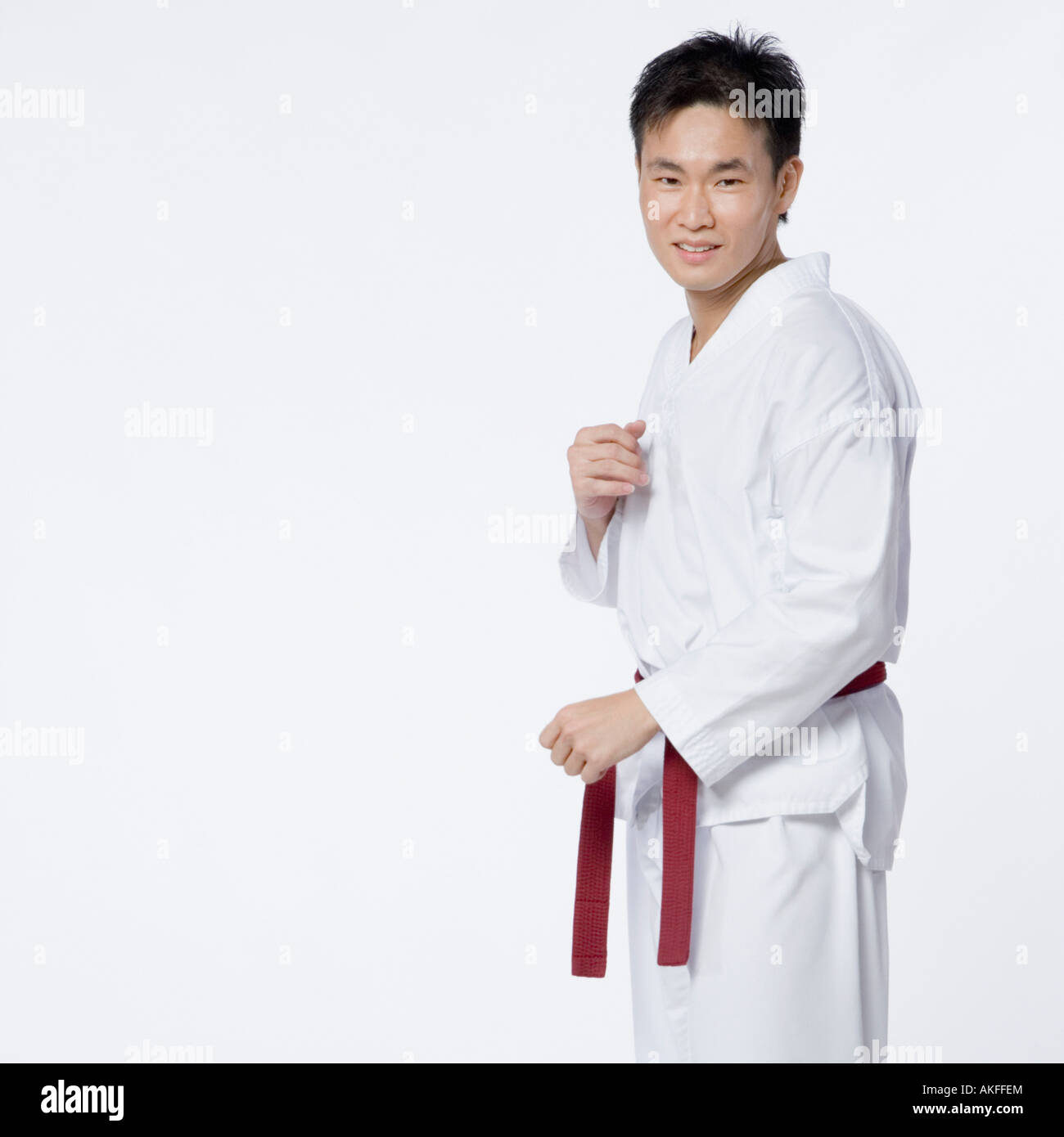 Portrait of a young man in fighting stance Stock Photo - Alamy