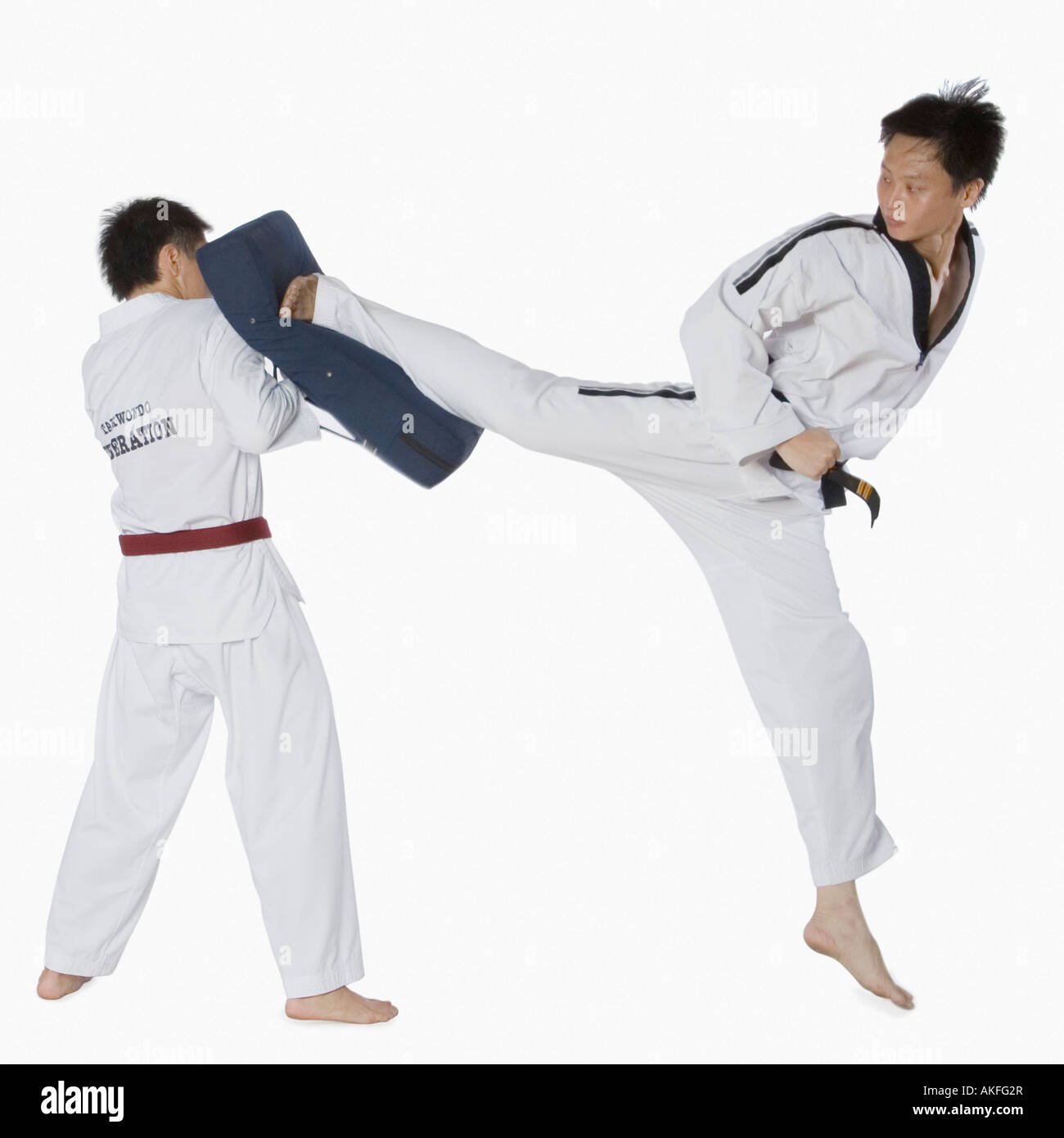 Male karate instructor teaching martial arts to a young man Stock Photo ...
