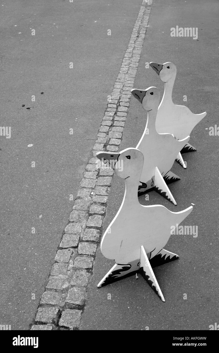 Three cutout street geese Stock Photo - Alamy