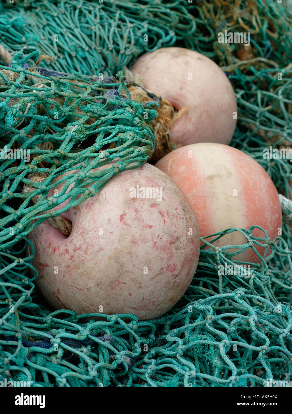Deep sea fishing nets and three buoys Stock Photo - Alamy