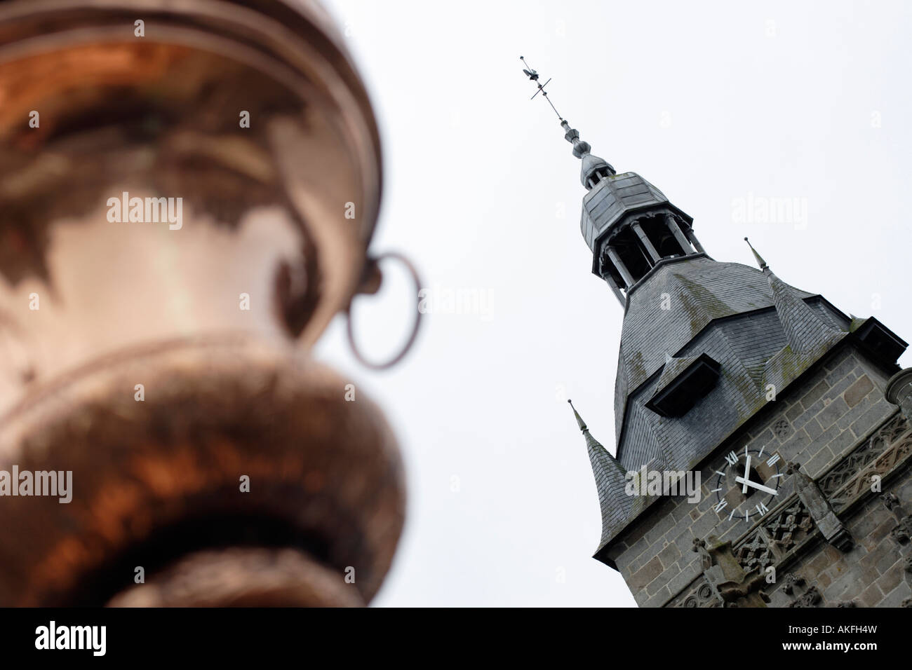Church spire and town square copper pot at Villedieu les Poeles La ...