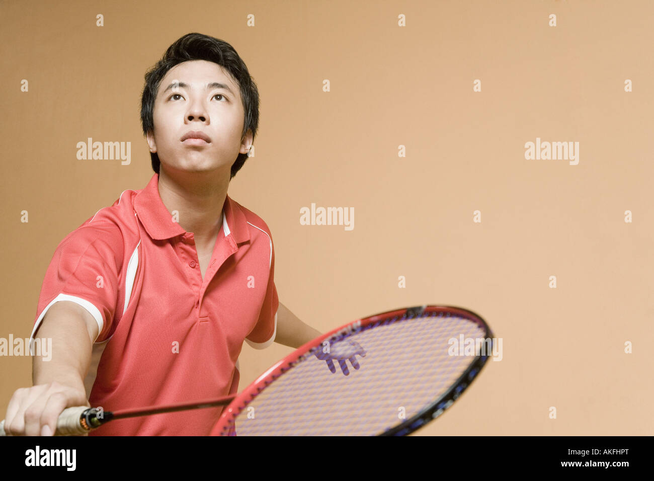 Close up young man playing badminton hi-res stock photography and ...