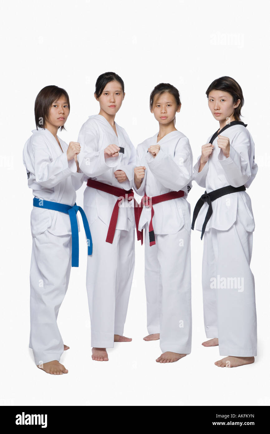 Portrait of four young women in fighting stance Stock Photo - Alamy