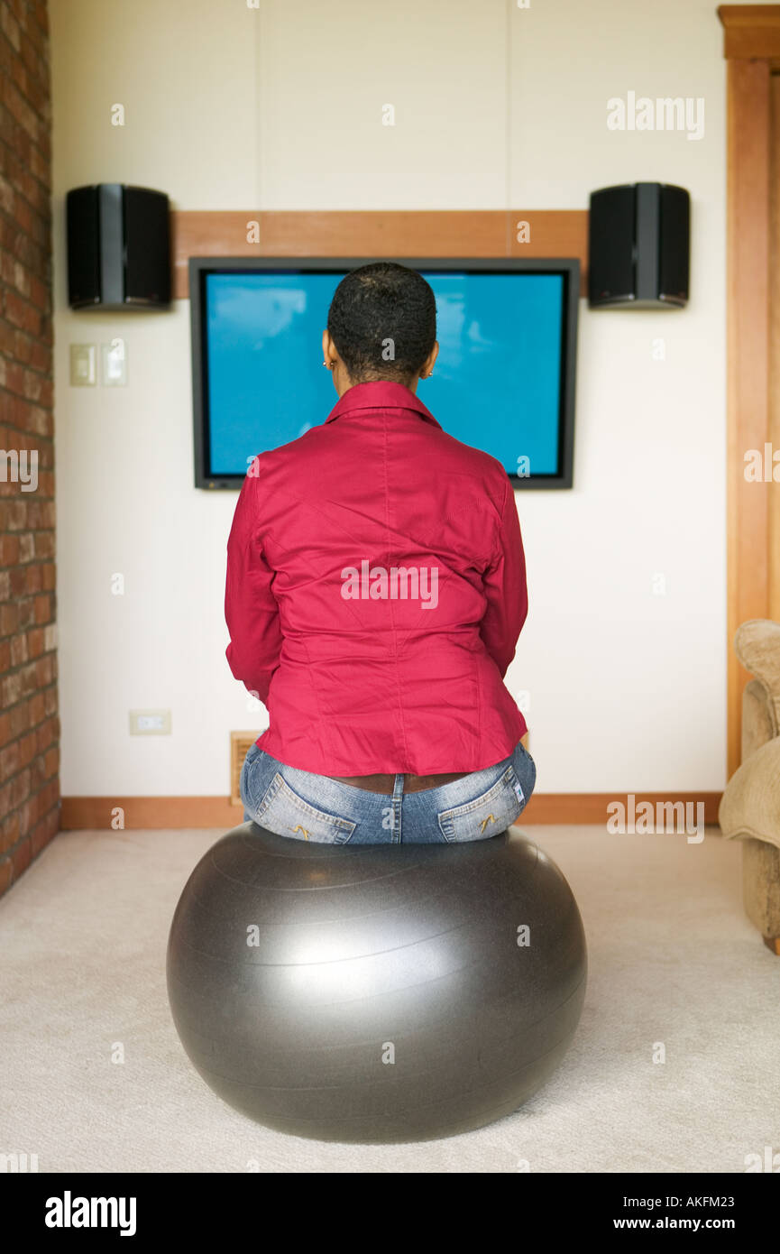 Women watching tv and multi tasking hi-res stock photography and images ...