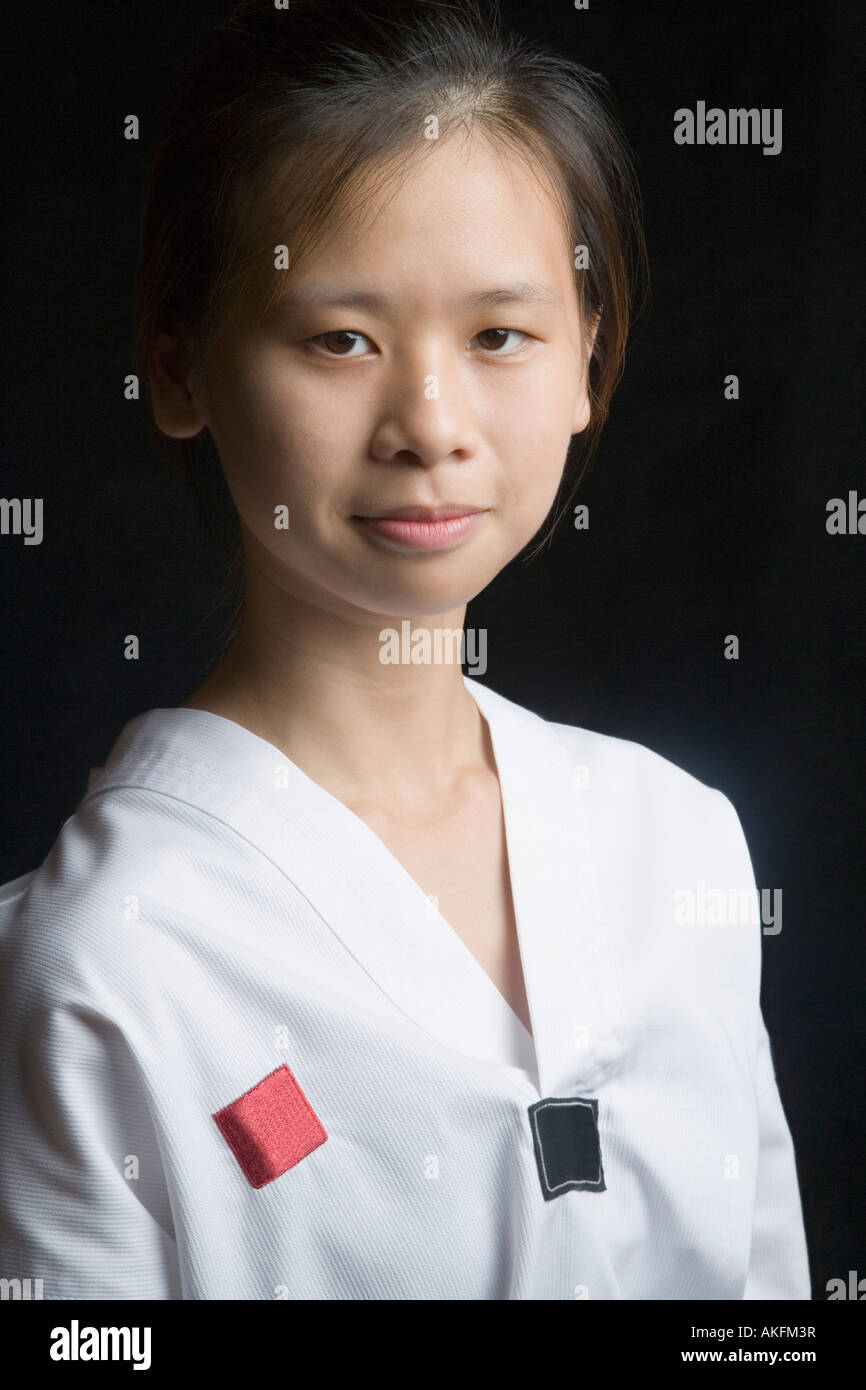 Portrait of a young woman looking confident Stock Photo - Alamy