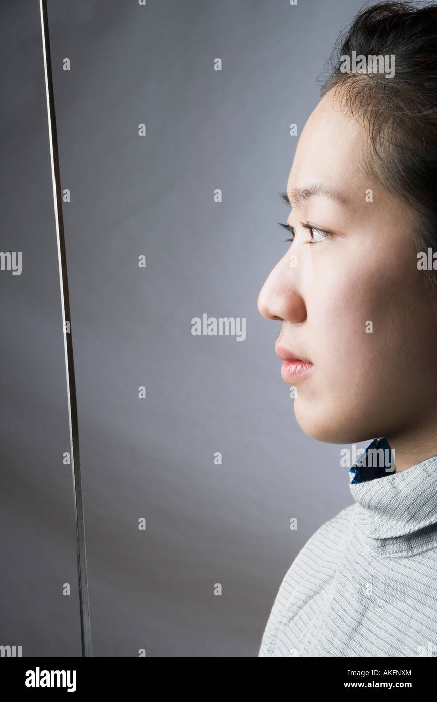 Close-up of a female fencer holding a sword Stock Photo - Alamy