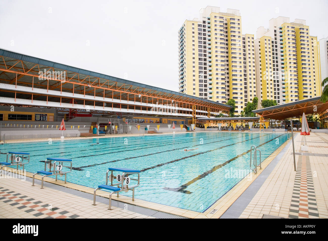 Swimming pool in front of buildings, Clementi Swimming Complex ...
