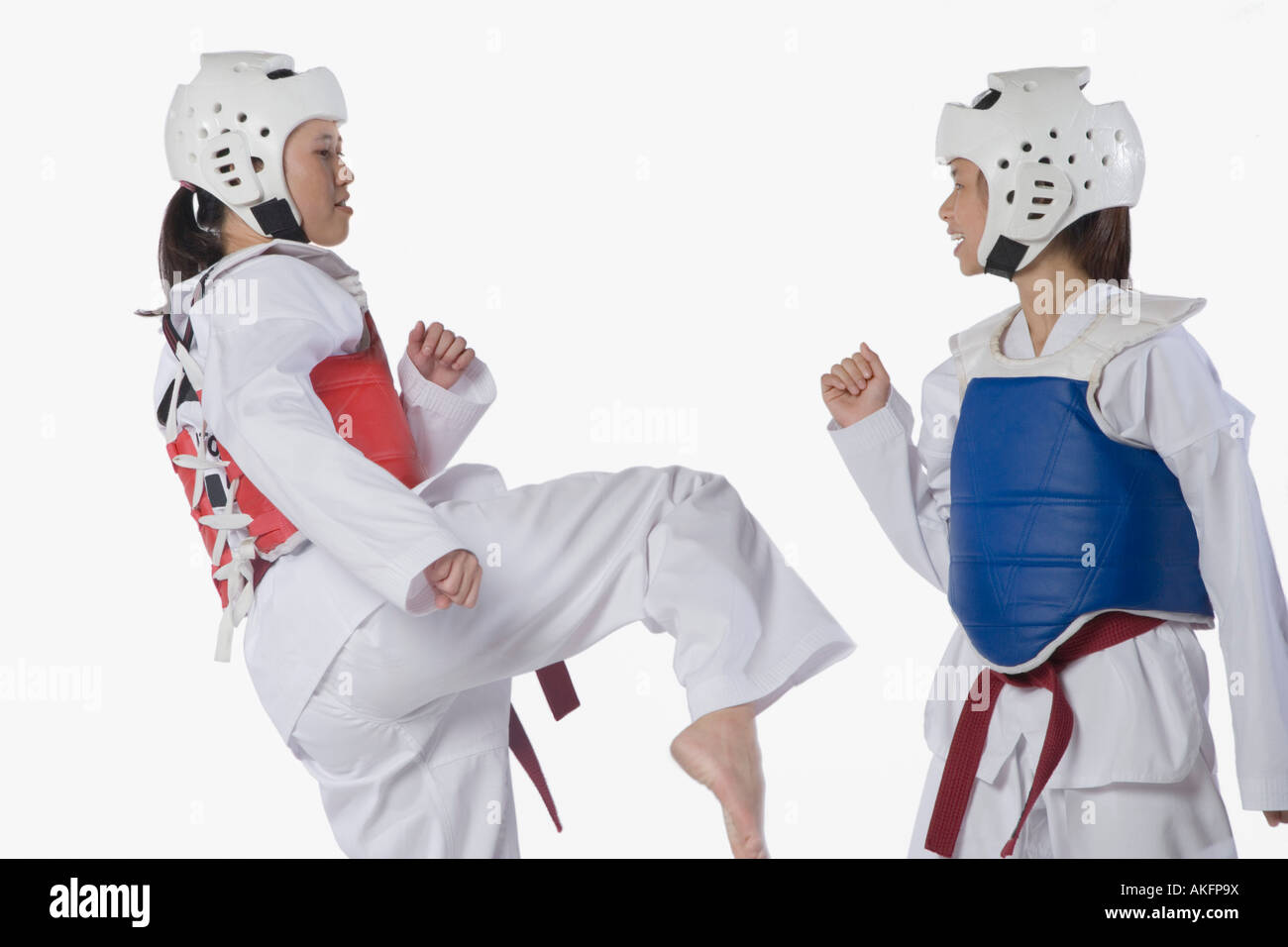 Two taekwondo players fighting Stock Photo - Alamy