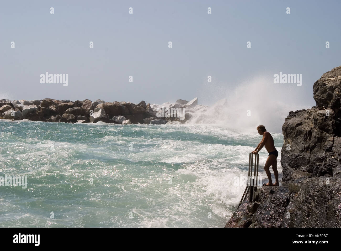 Man at waves staring hi-res stock photography and images - Alamy