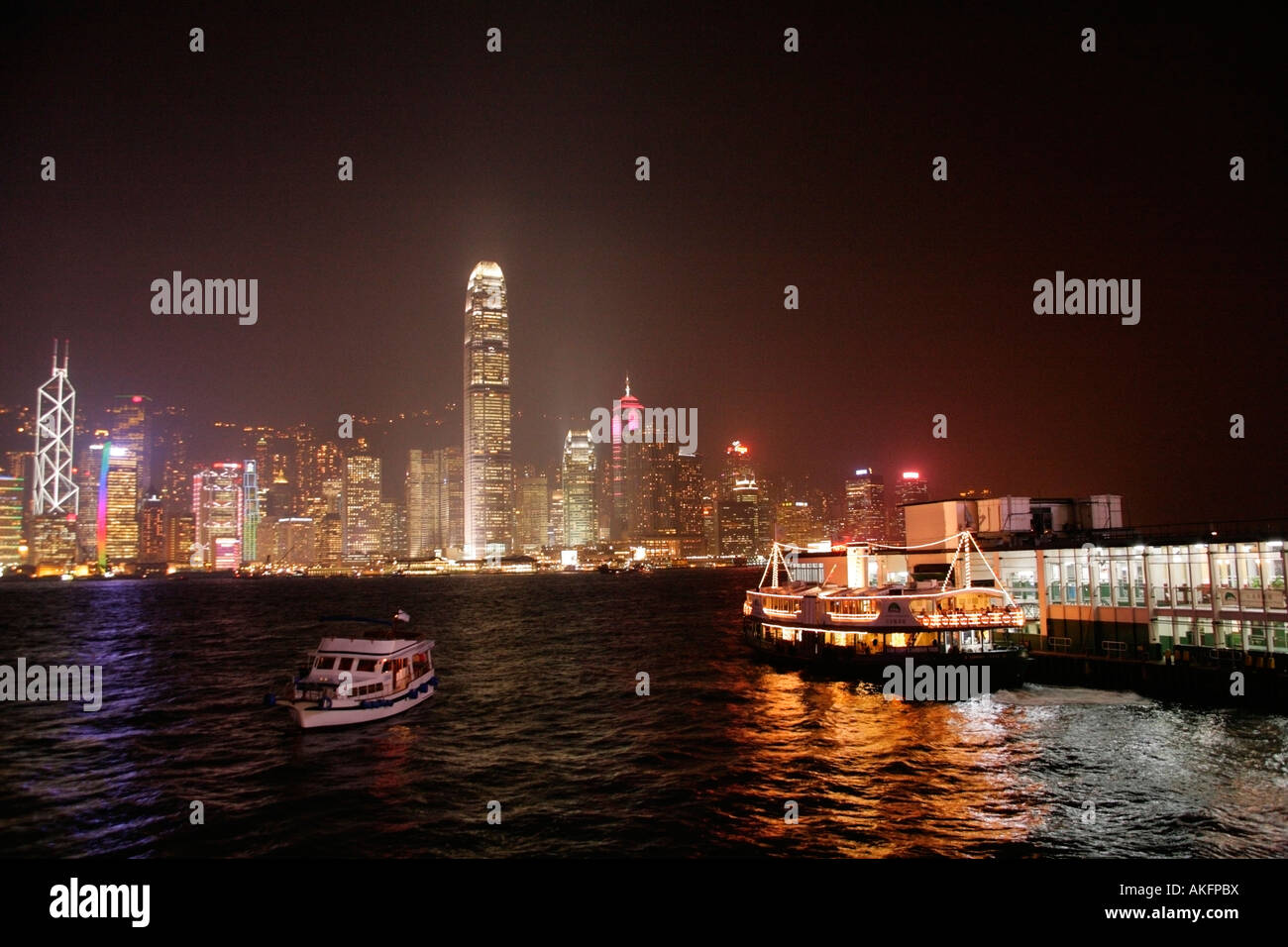 Night time illuminated Hong Kong Island from Star Ferry Quay, Kowloon ...