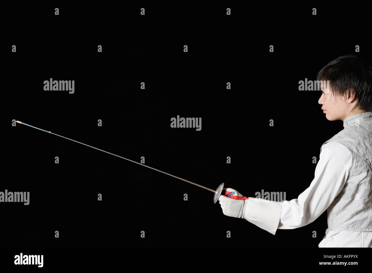 Male fencer holding a fencing foil Stock Photo - Alamy